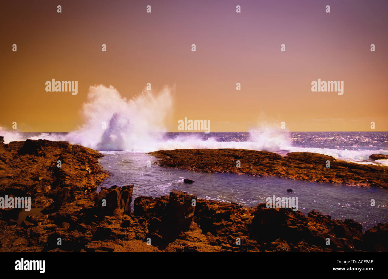Wave crashing on coastal rocks hi-res stock photography and images - Alamy