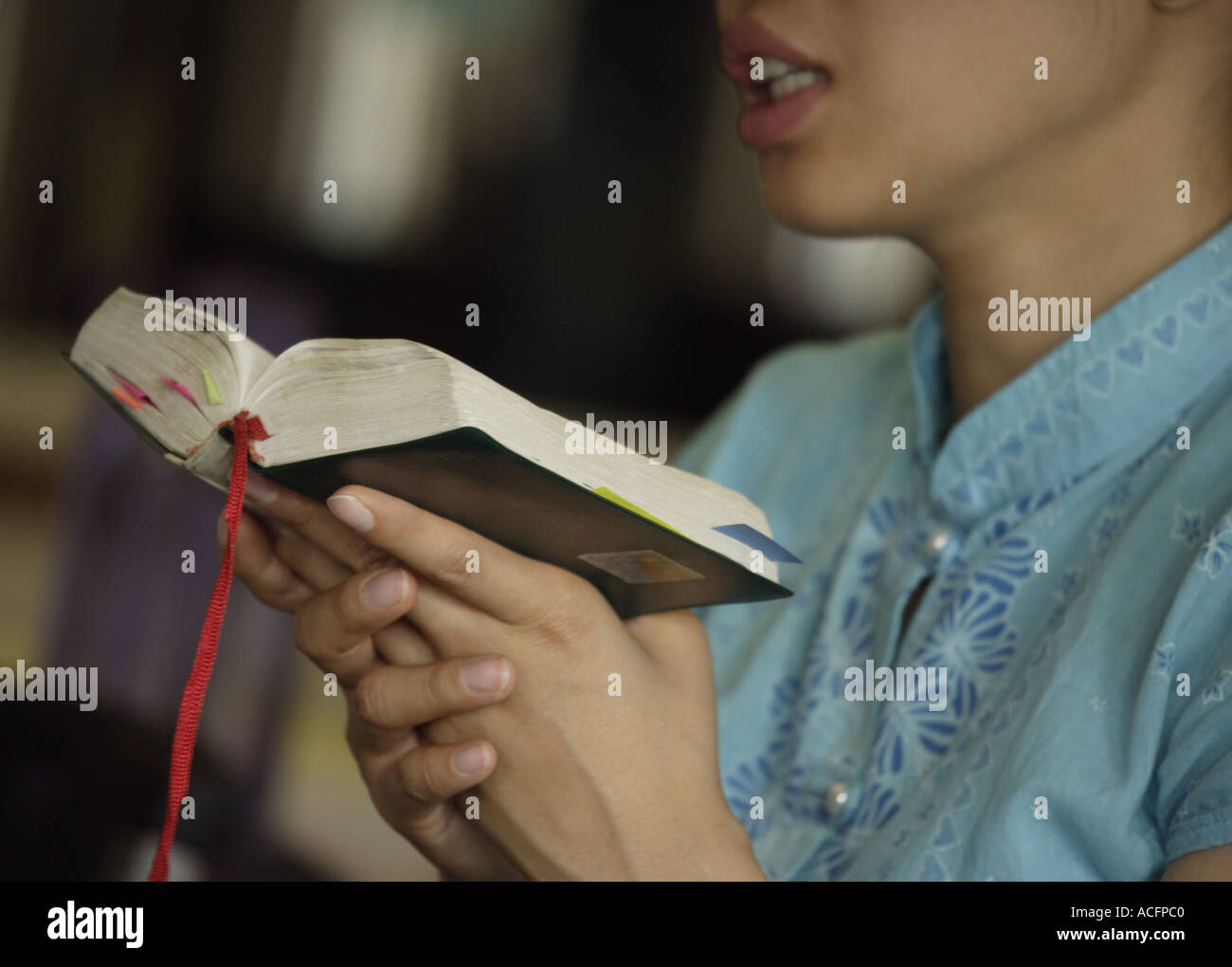 Woman reading from the Bible Stock Photo - Alamy