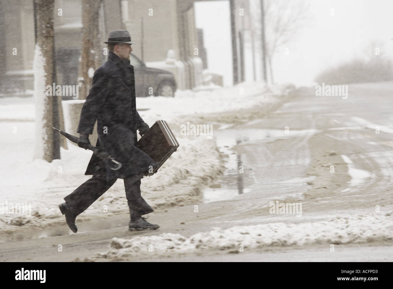 Businessman walking in snow hi-res stock photography and images - Alamy