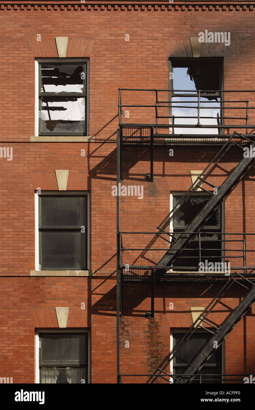 Outdoor fire escape of a burned out building Stock Photo - Alamy