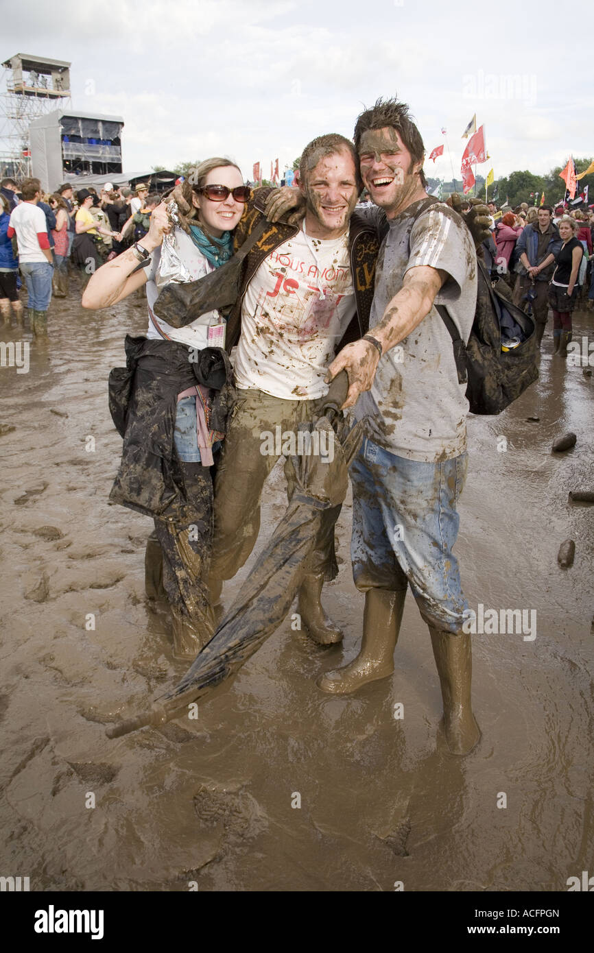 Punters covered in mud at the Glastonbury music festival 2007 Stock ...