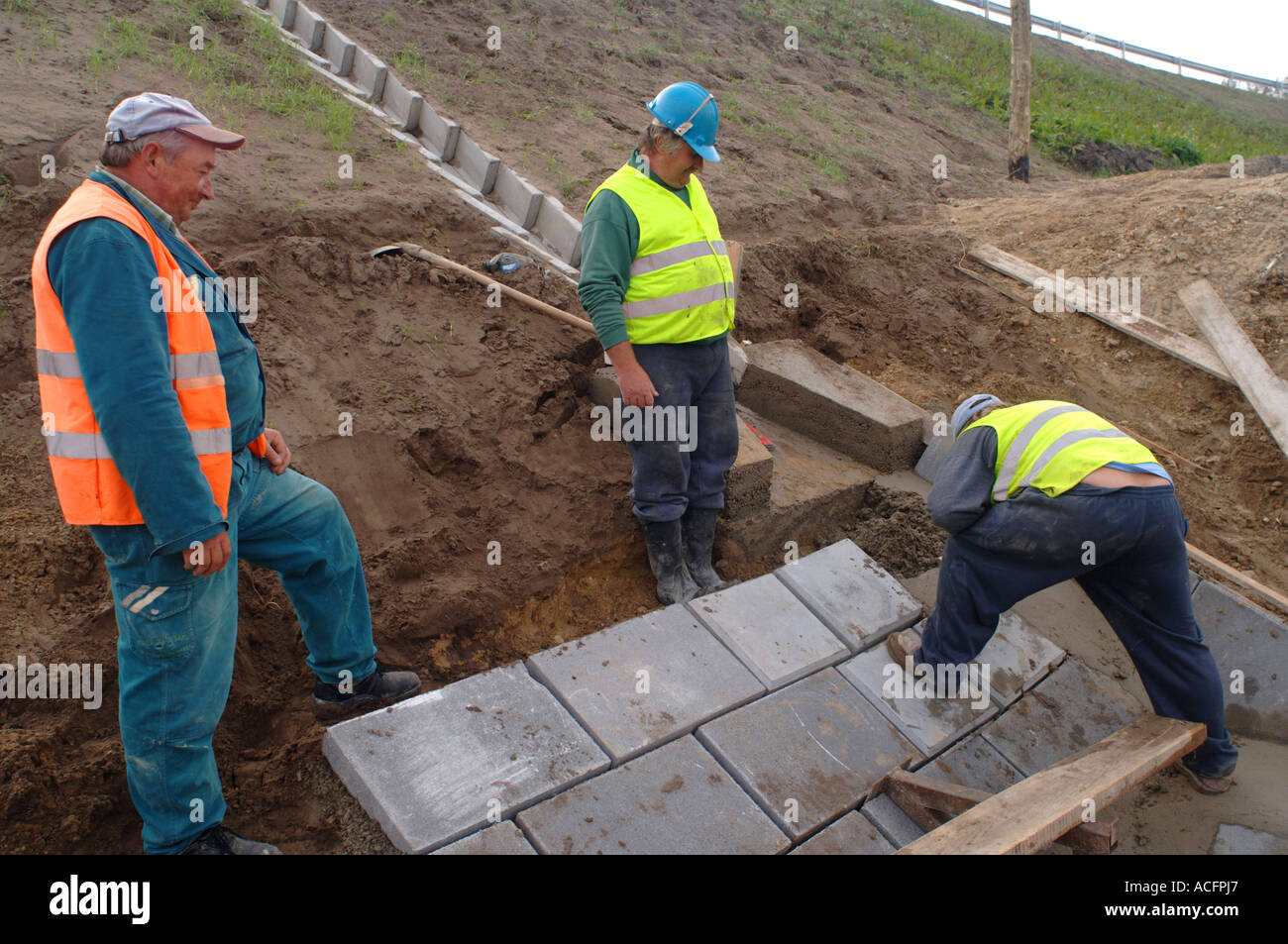 Laying road - workers constructing the M5 toll motorway in Hungary ...
