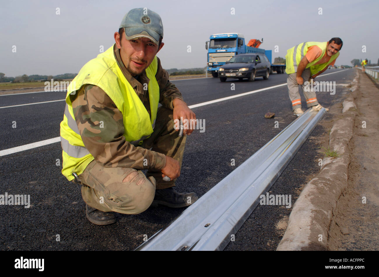 Laying road - workers constructing the M5 toll motorway in Hungary ...