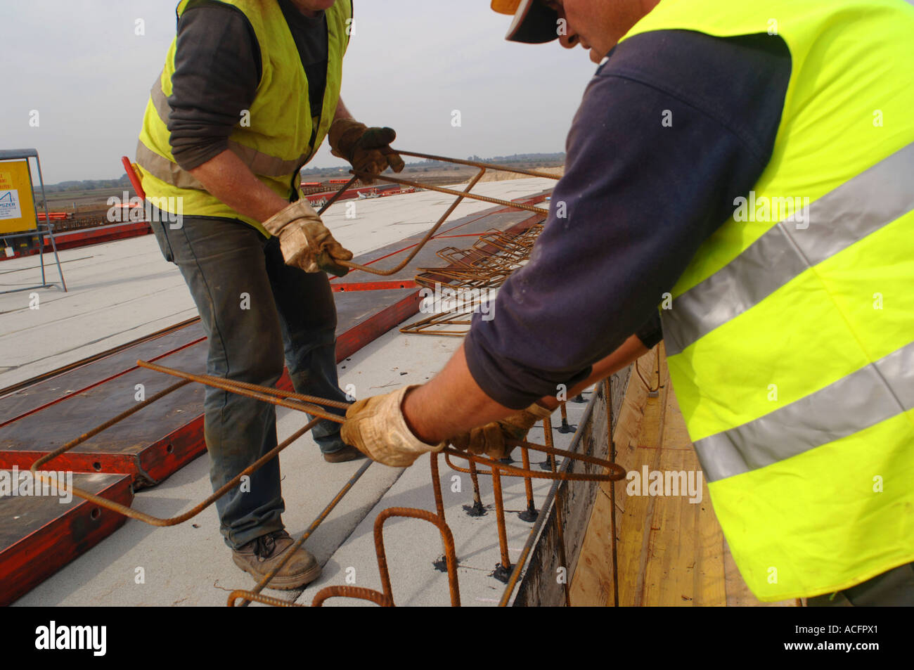 Laying road - workers constructing a bridge on the M5 toll motorway in ...