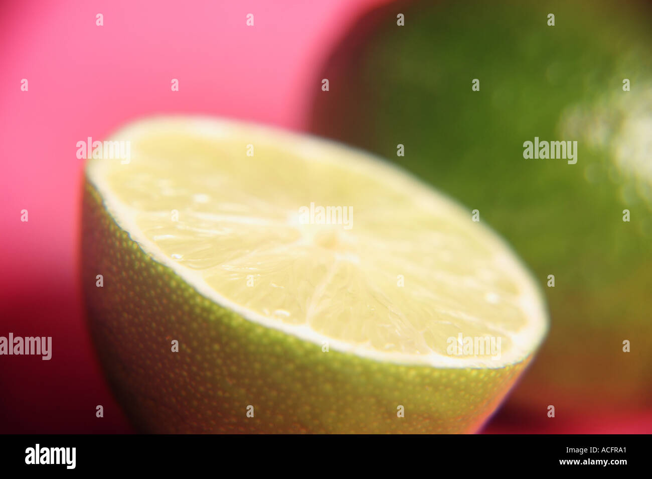 A lime cut in half Stock Photo - Alamy
