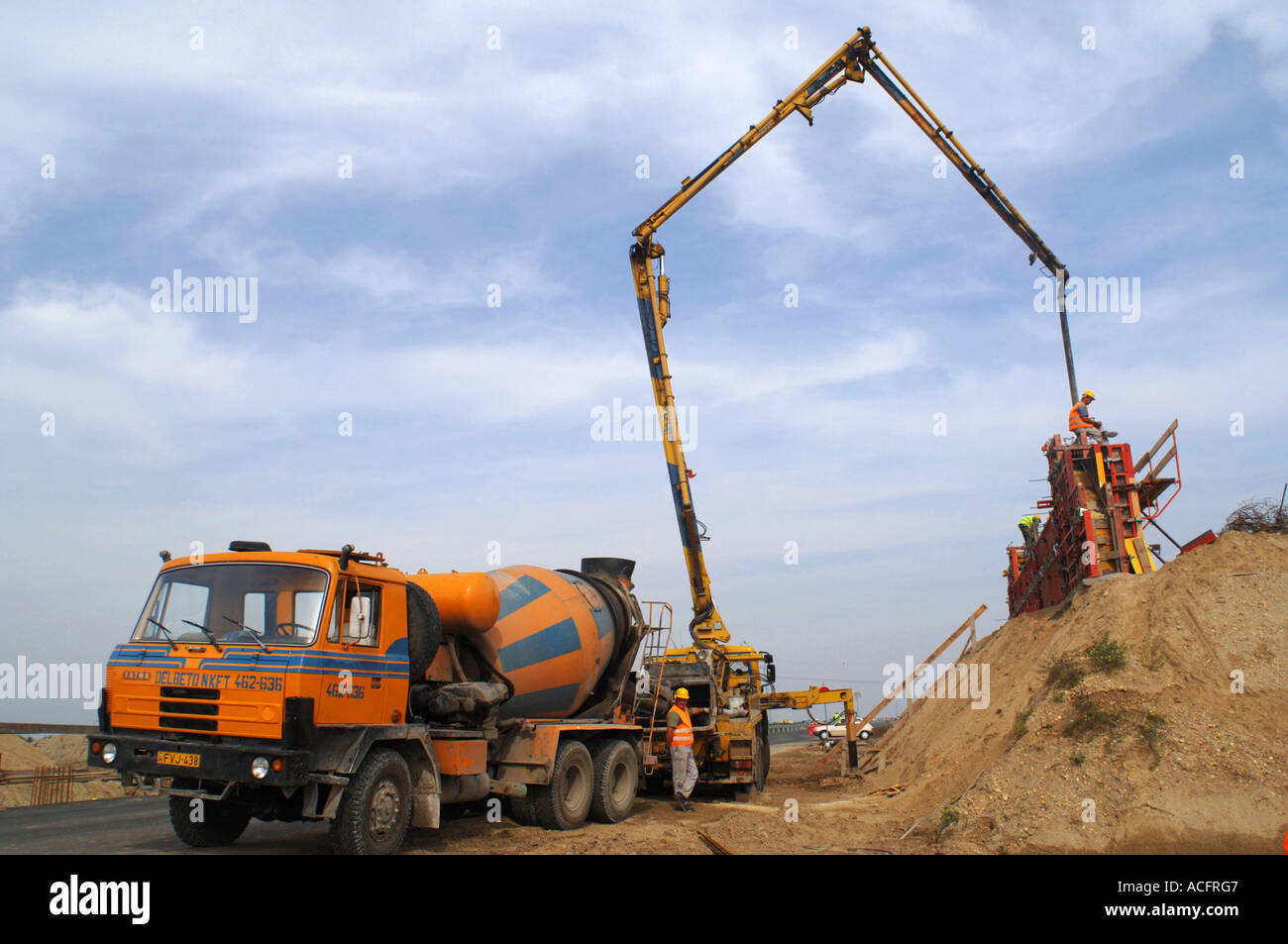 Laying road - workers constructing a bridge on the M5 toll motorway in ...