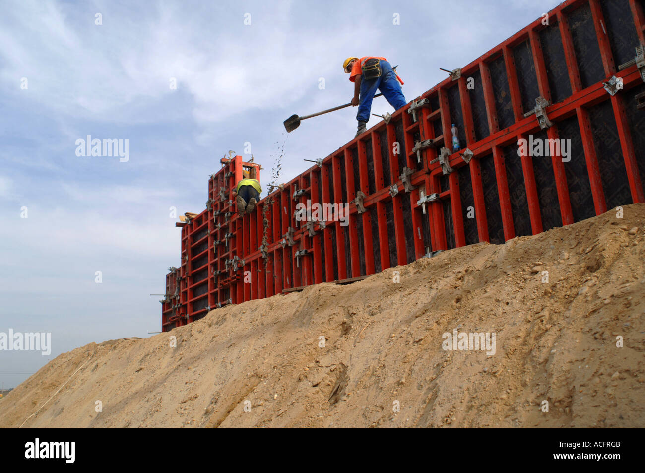 Laying road - workers constructing a bridge on the M5 toll motorway in ...