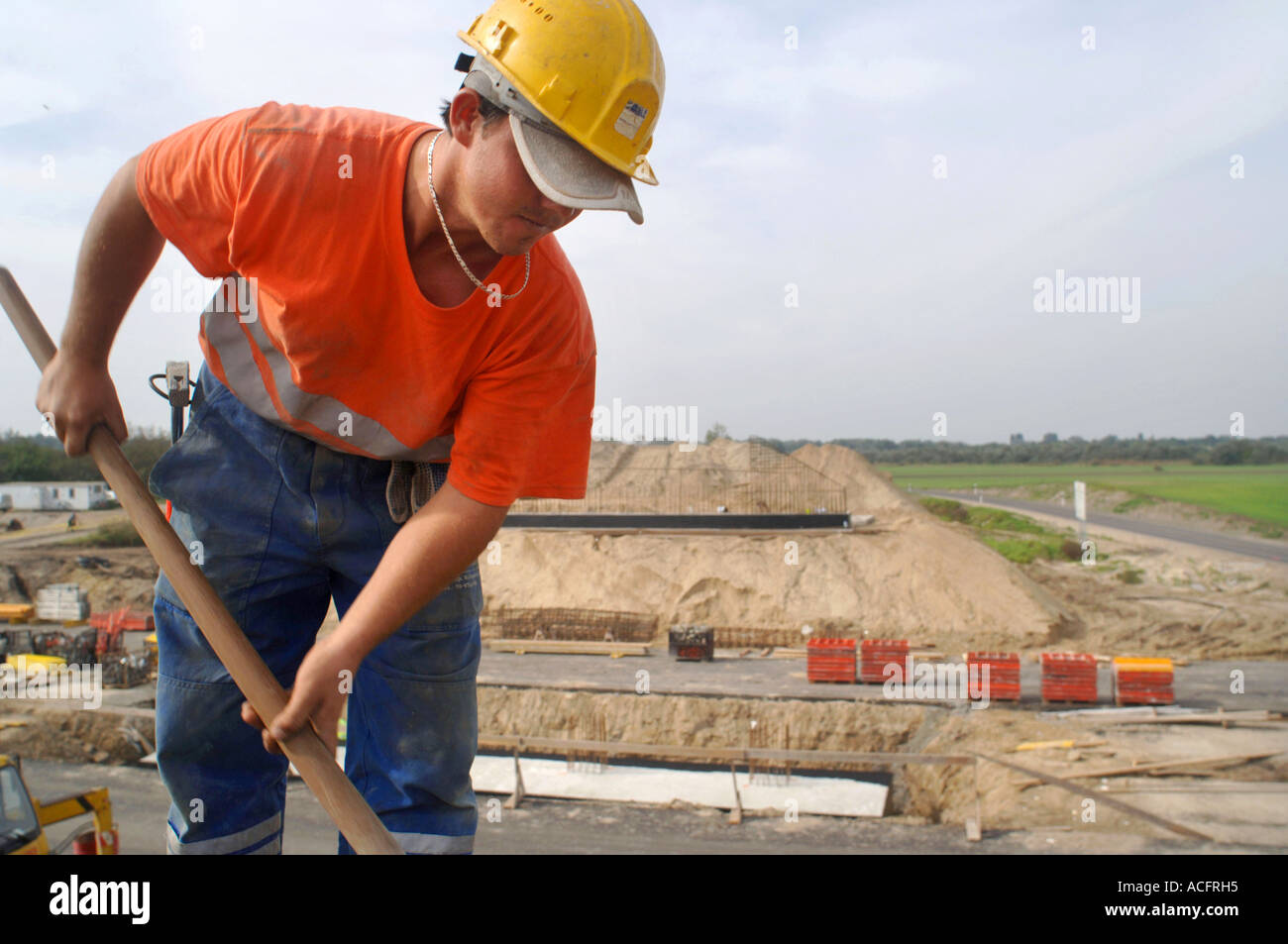 Laying road - workers constructing a bridge on the M5 toll motorway in ...