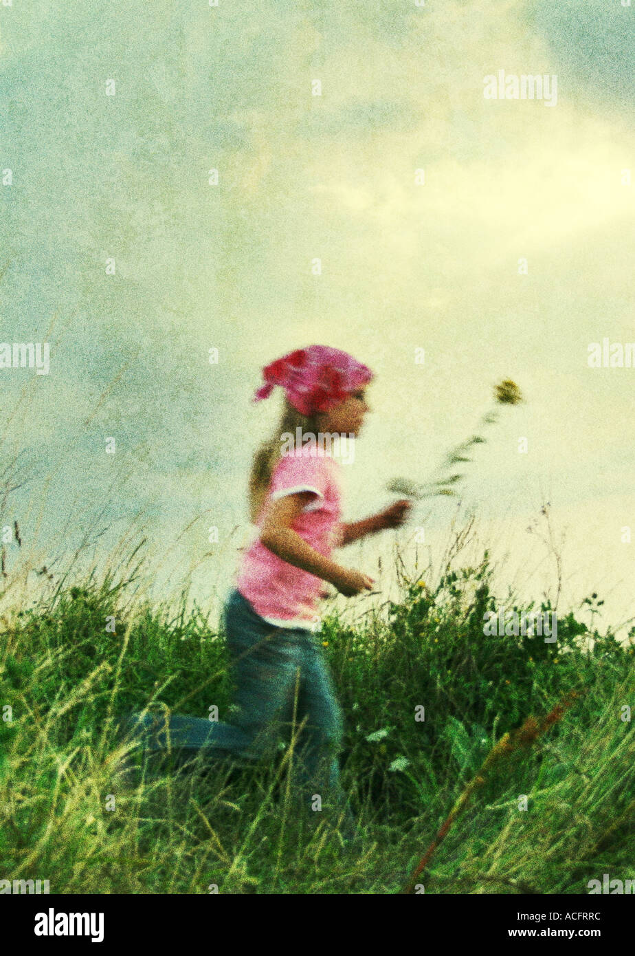 photo of a girl running with a flower in her hand Stock Photo - Alamy