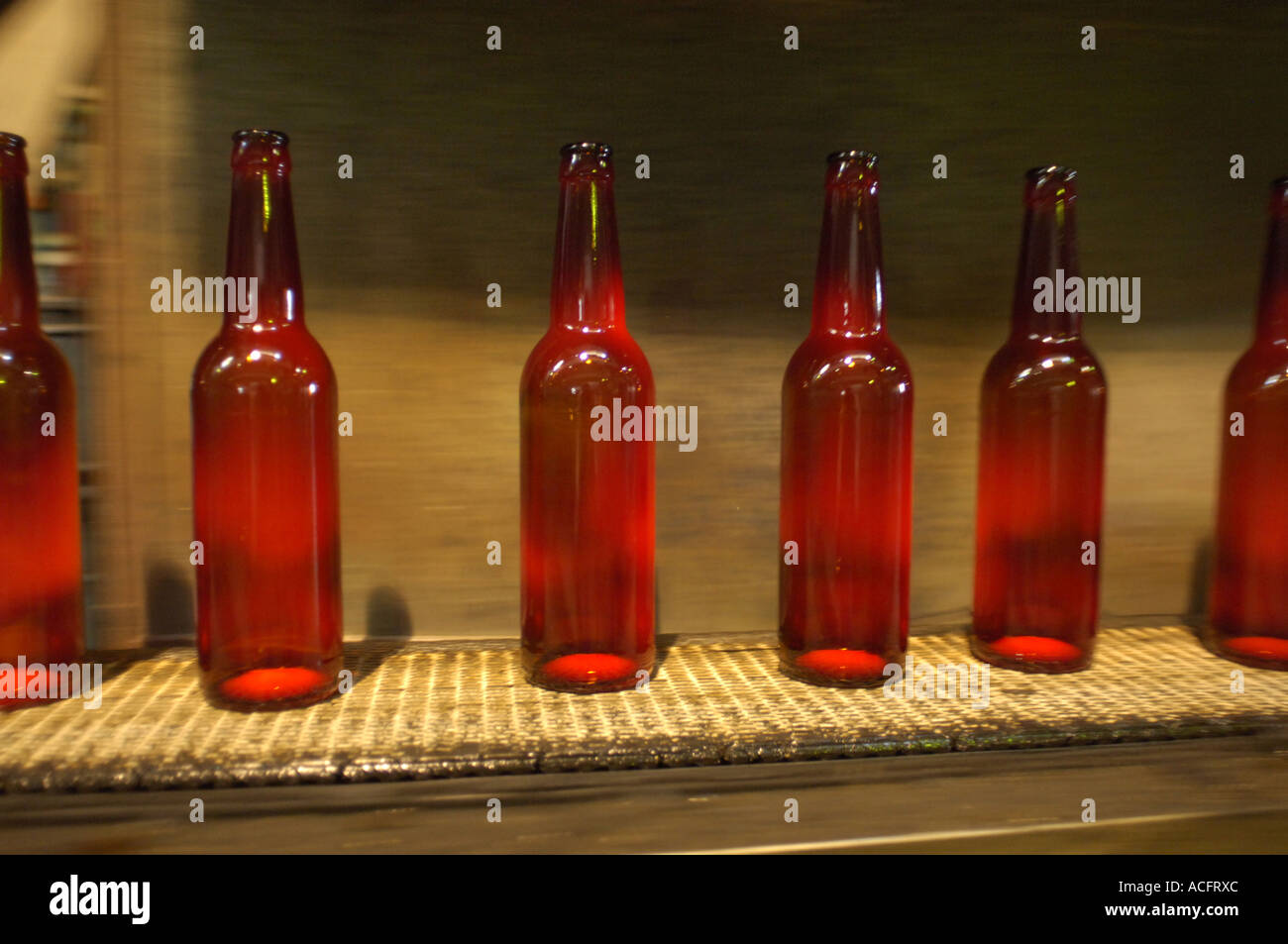 Red hot glass bottles being produced in Gostomel bottle making factory ...