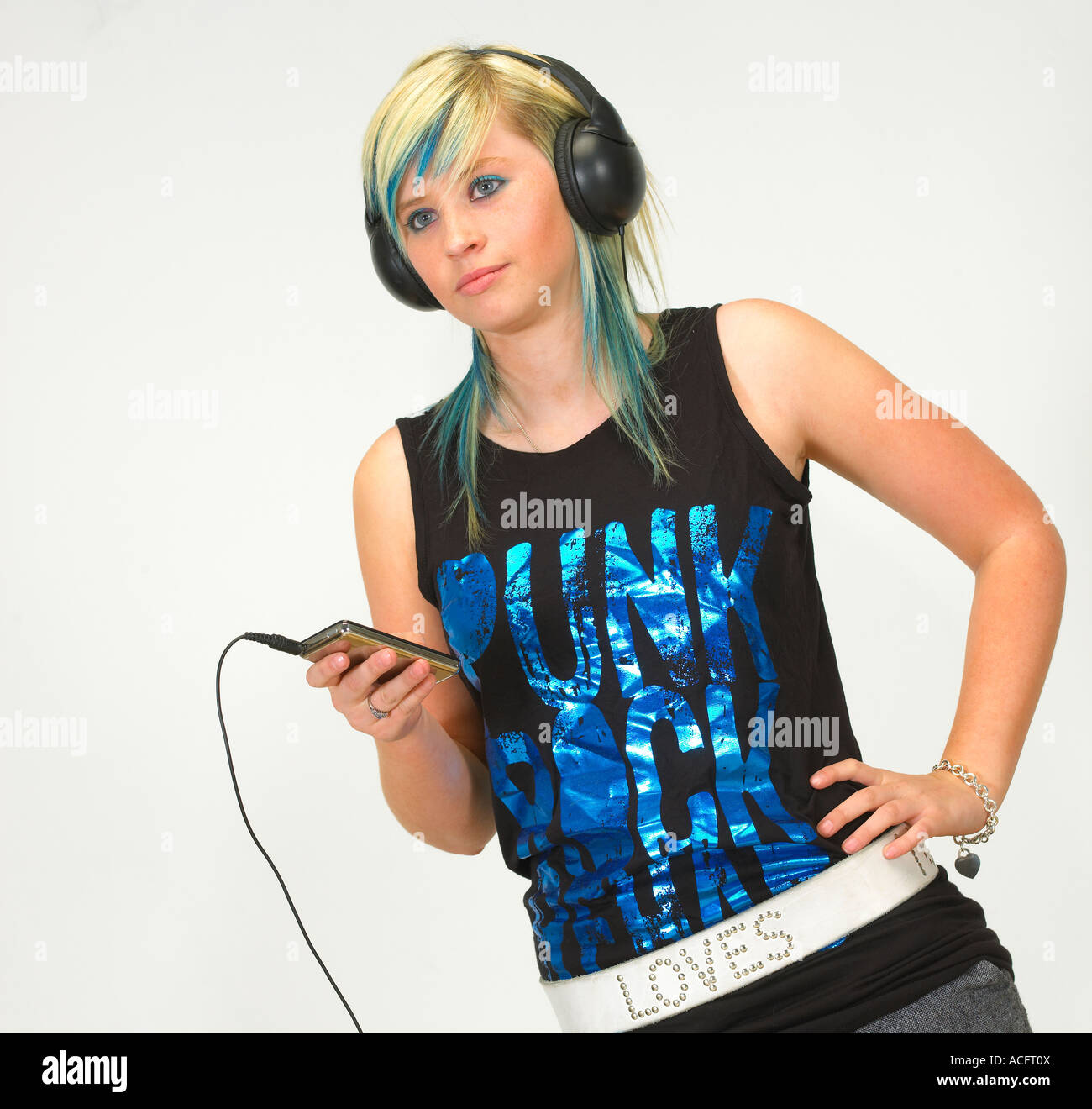 TEENAGE GIRL POSING WITH IPOD MUSIC PLAYER Stock Photo - Alamy
