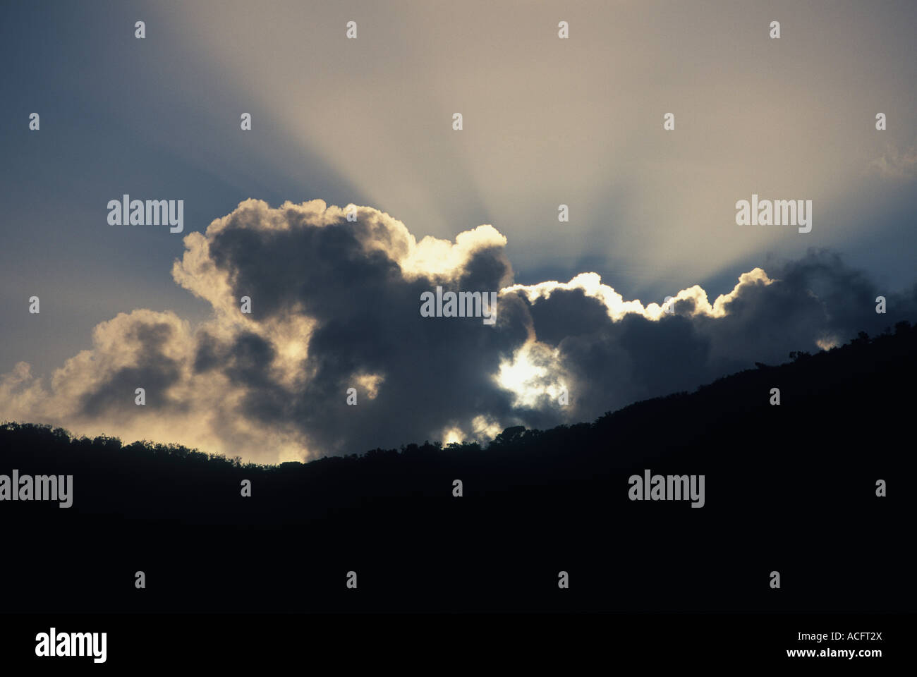 Sunburst explodes through the clouds Stock Photo - Alamy