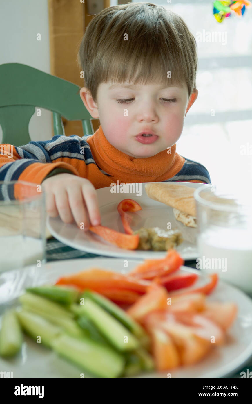 Young boy eating his healthy lunch Model Released Stock Photo - Alamy