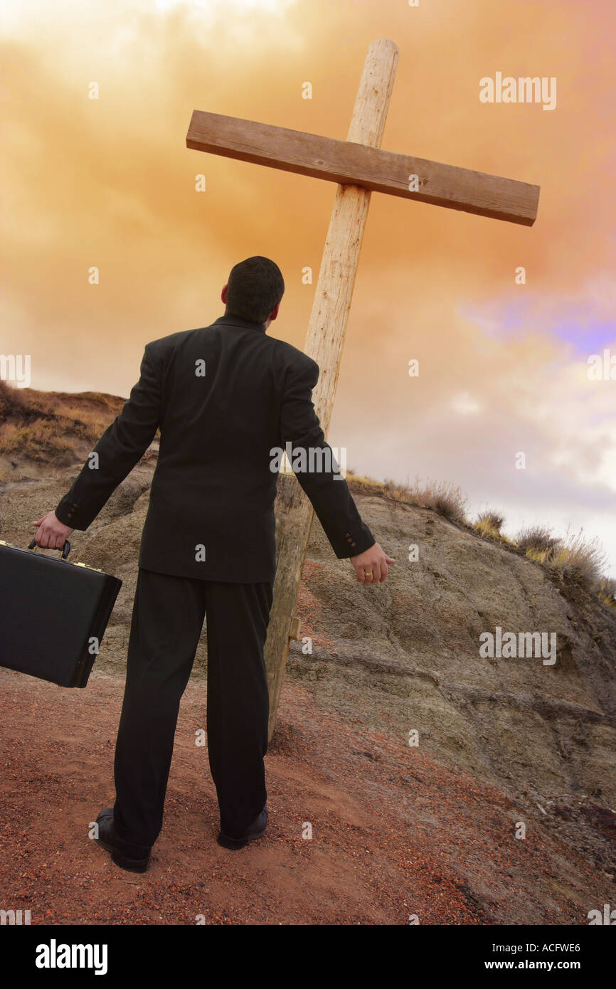 Businessman at cross Stock Photo - Alamy