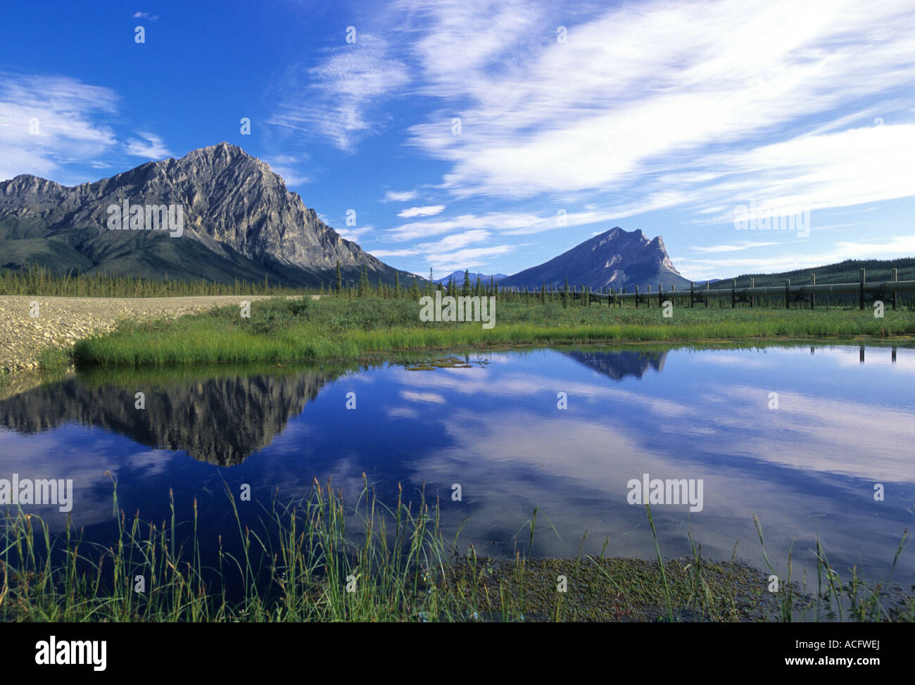 Reflection of mountain in lake in Gates of the Arctic National Park and ...