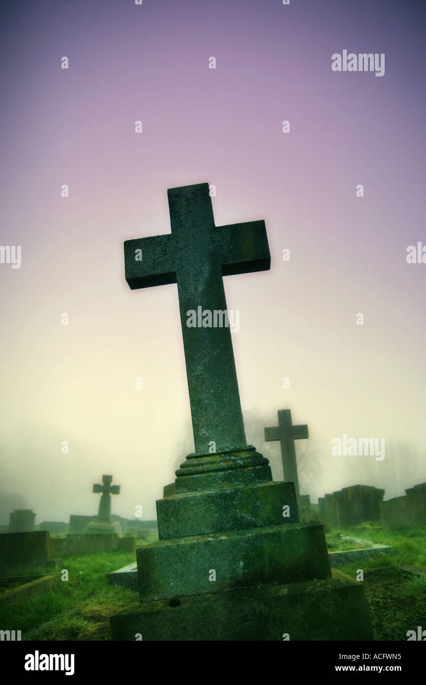 Photo of a cross in a graveyard Stock Photo - Alamy
