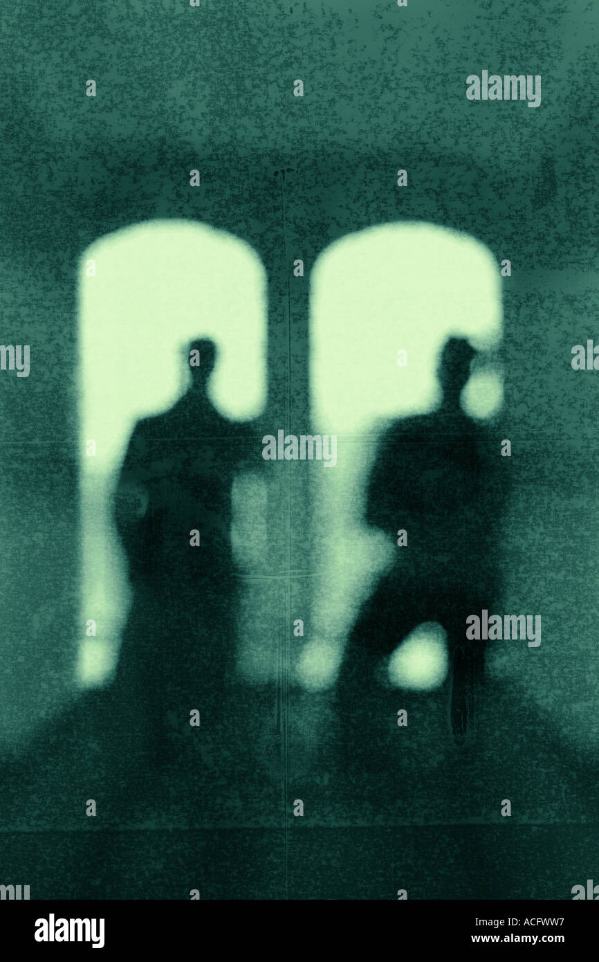 Photo of two figures infront of an arched window Stock Photo - Alamy
