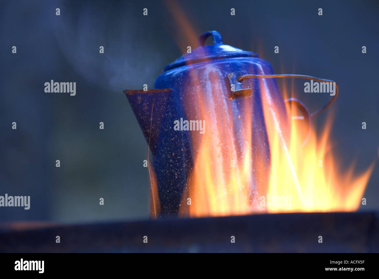 Camping kettle over fire Stock Photo - Alamy