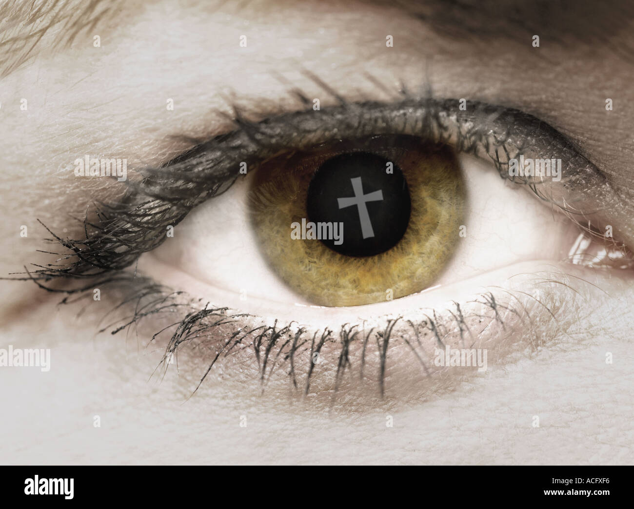 Cross reflected in an eye Stock Photo - Alamy