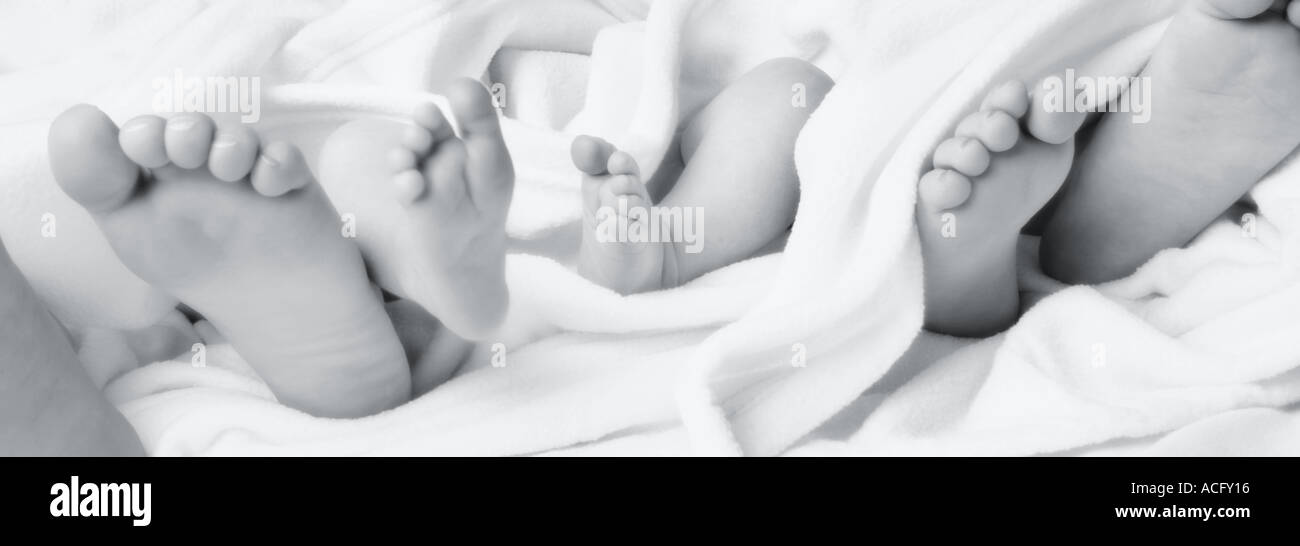 Different sized children s feet Stock Photo - Alamy