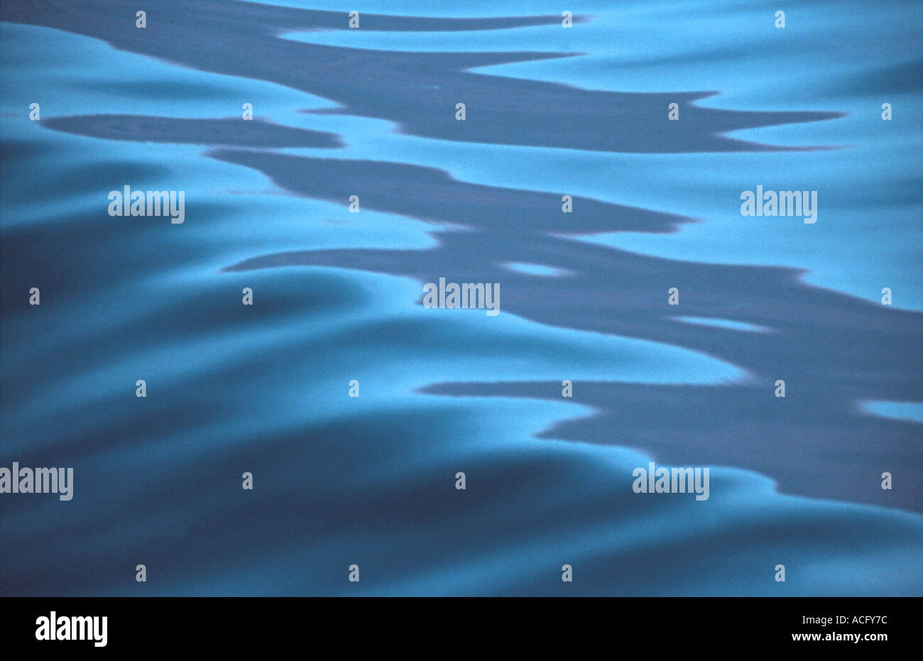 Blue reflections on water Stock Photo - Alamy