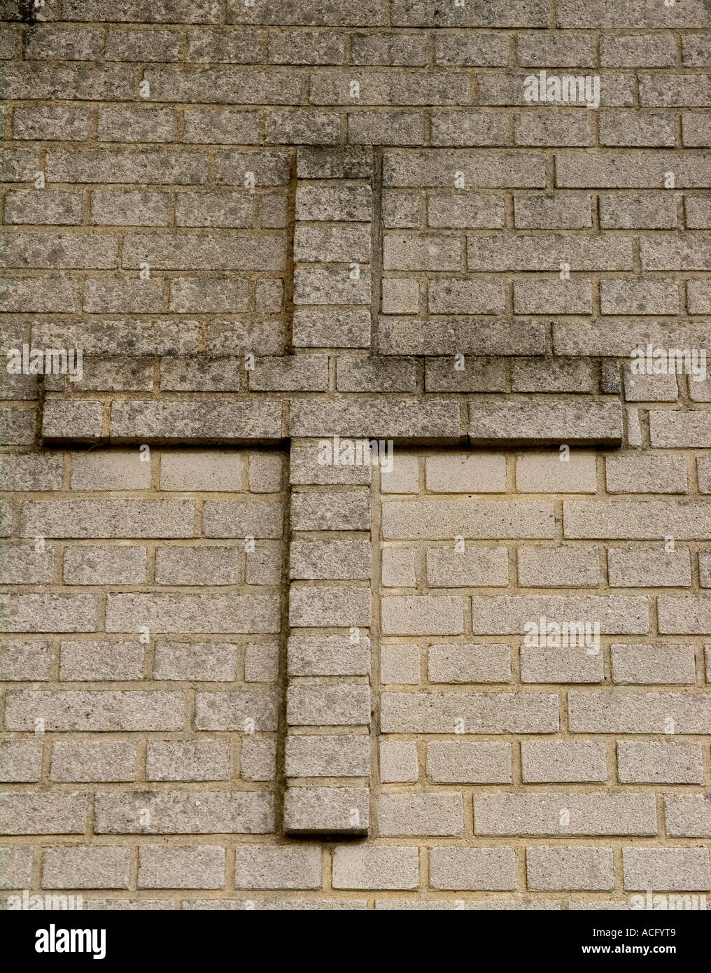Stone cross embedded in brick wall Stock Photo - Alamy