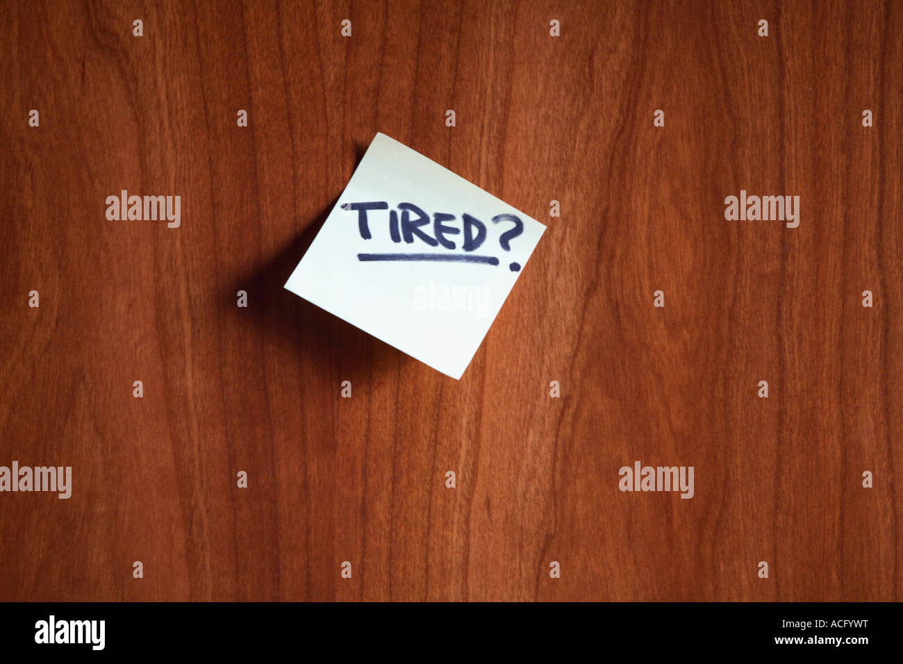 tired ? written on post it note memo Stock Photo - Alamy