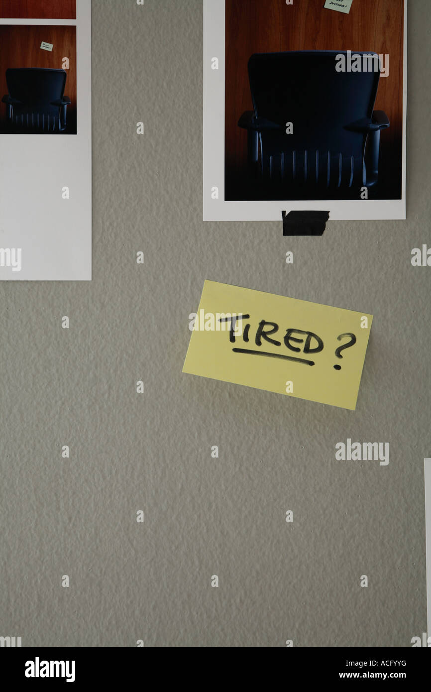 tired written on post it note memo Stock Photo - Alamy