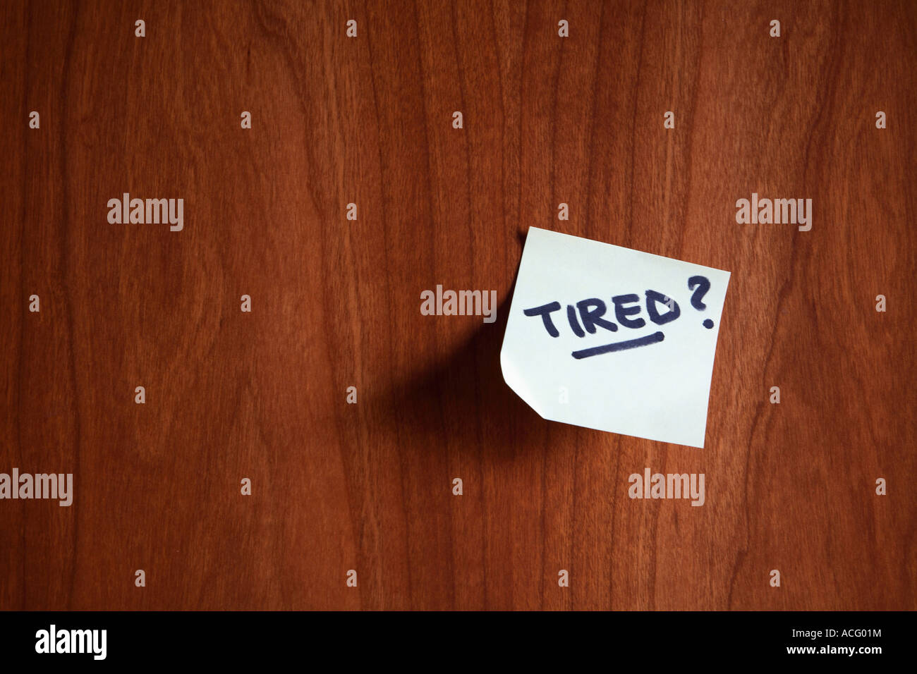 tired ? written on post it note memo Stock Photo - Alamy