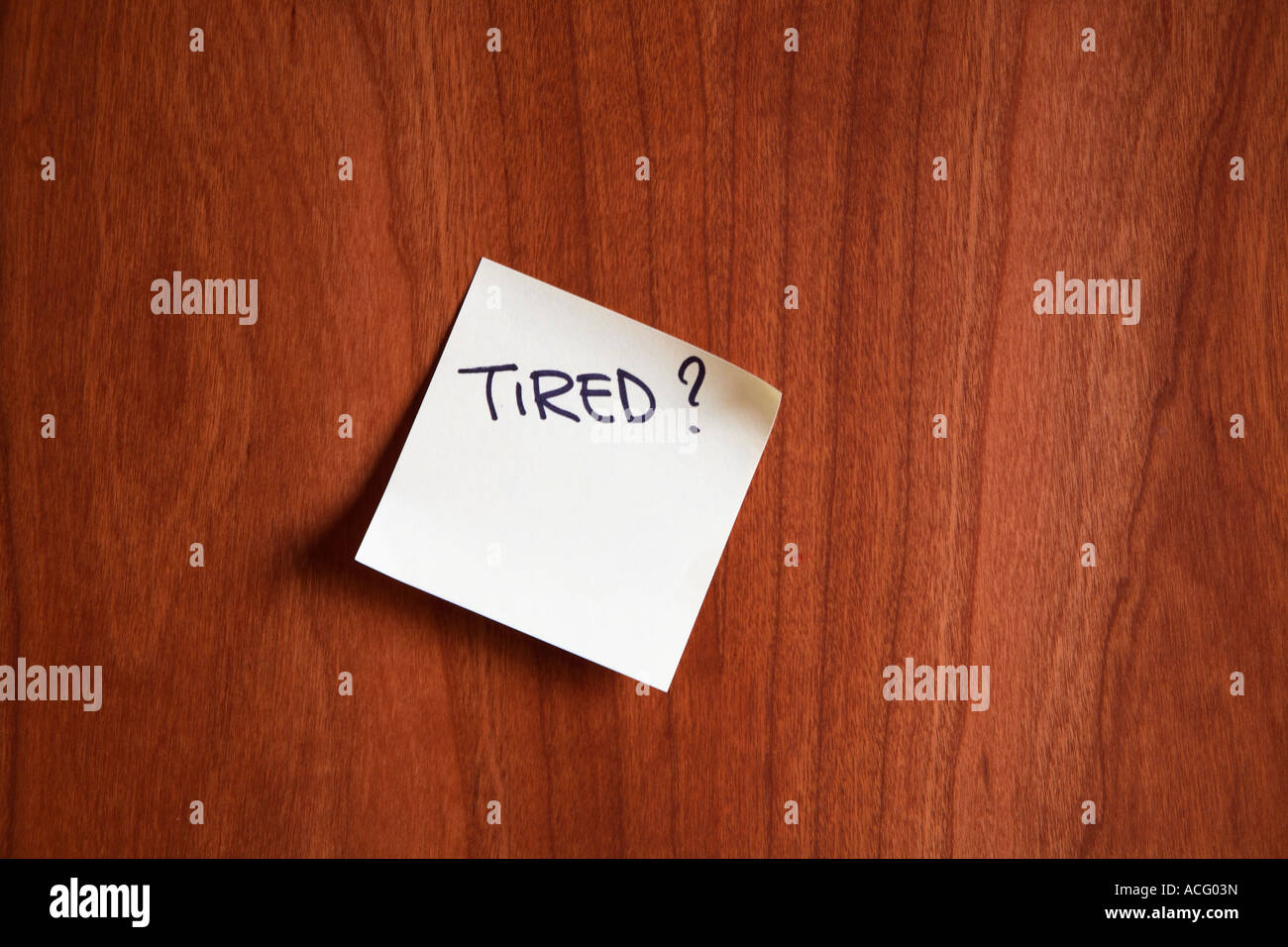 tired ? written on post it note memo Stock Photo - Alamy