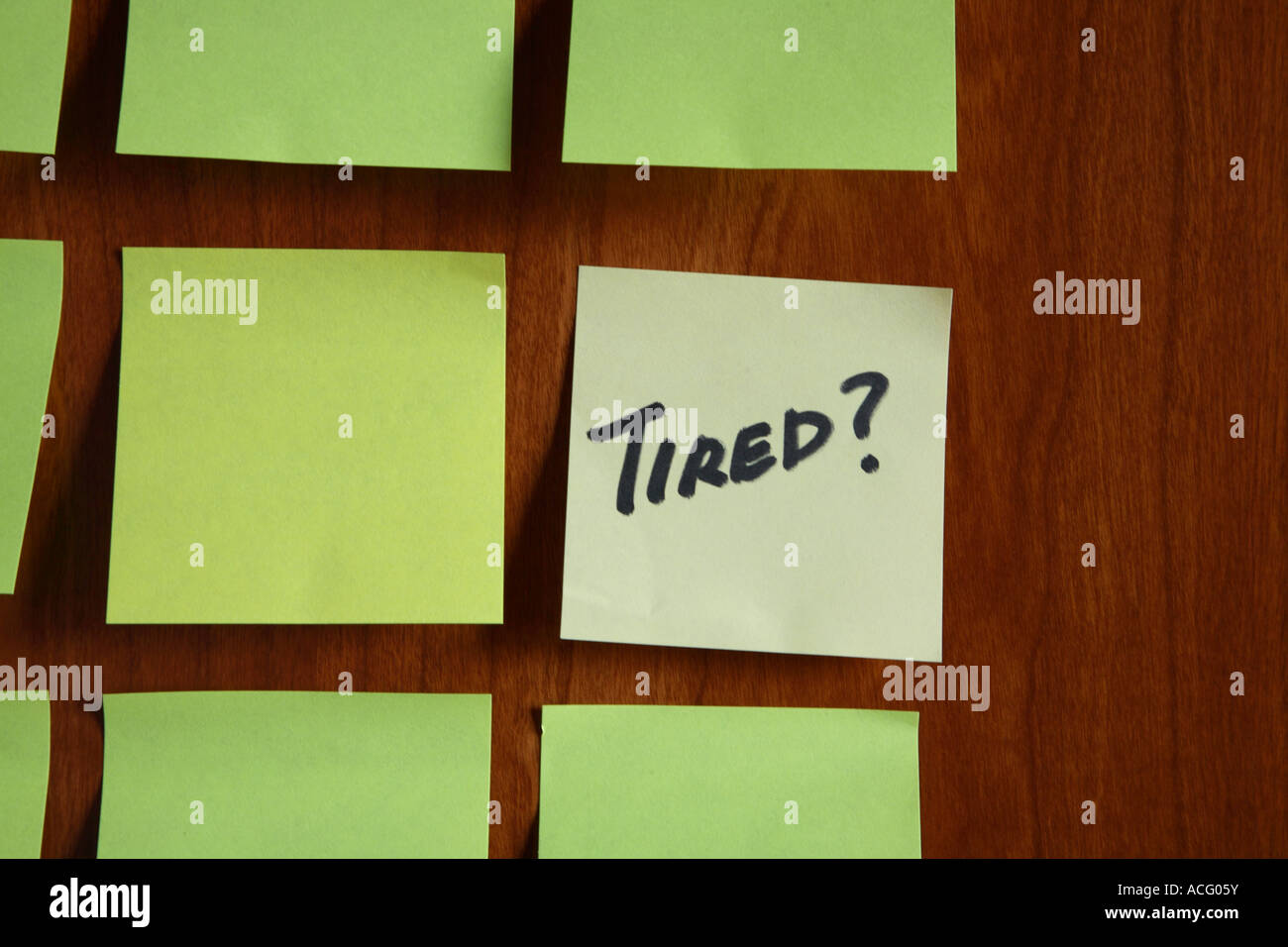 tired ? written on post it note memo Stock Photo - Alamy