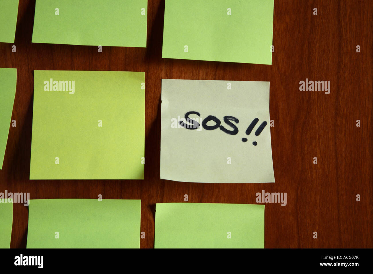 sos !! written on post it note memo Stock Photo - Alamy