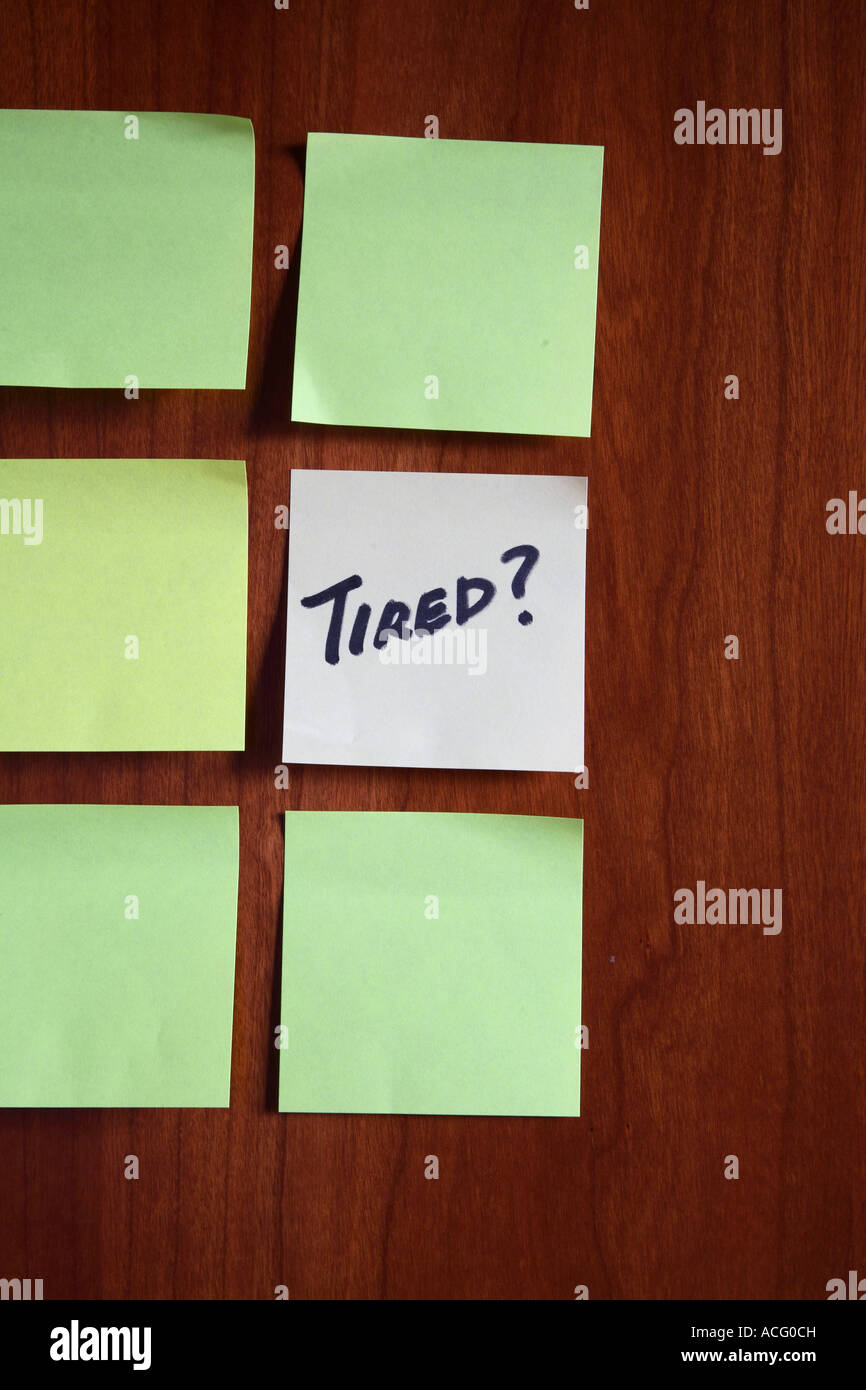 tired ? written on a post it memo note Stock Photo - Alamy