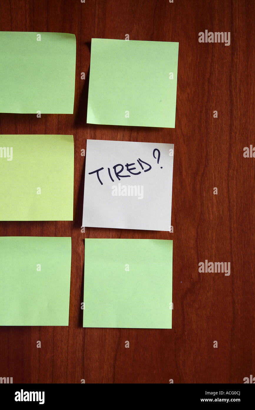 tired ? written on a post it memo note Stock Photo - Alamy