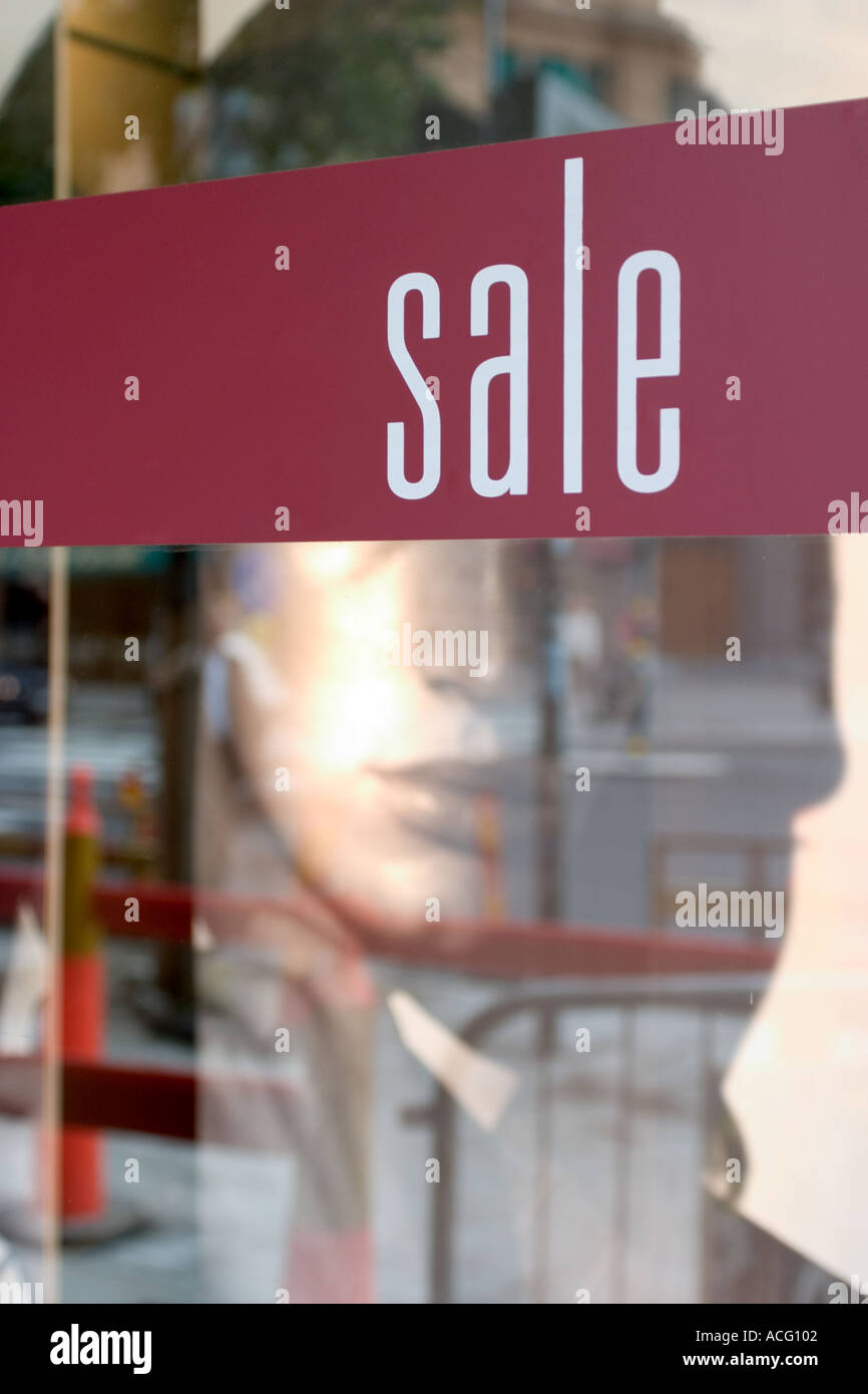 Sale sign in shop window Stock Photo - Alamy