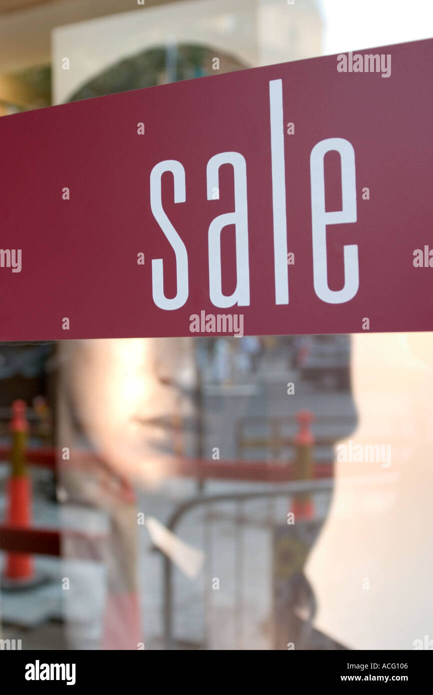 Sale sign in shop window Stock Photo - Alamy