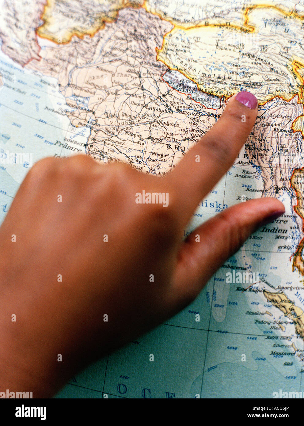An index finger pointing on a map close-up Stock Photo - Alamy