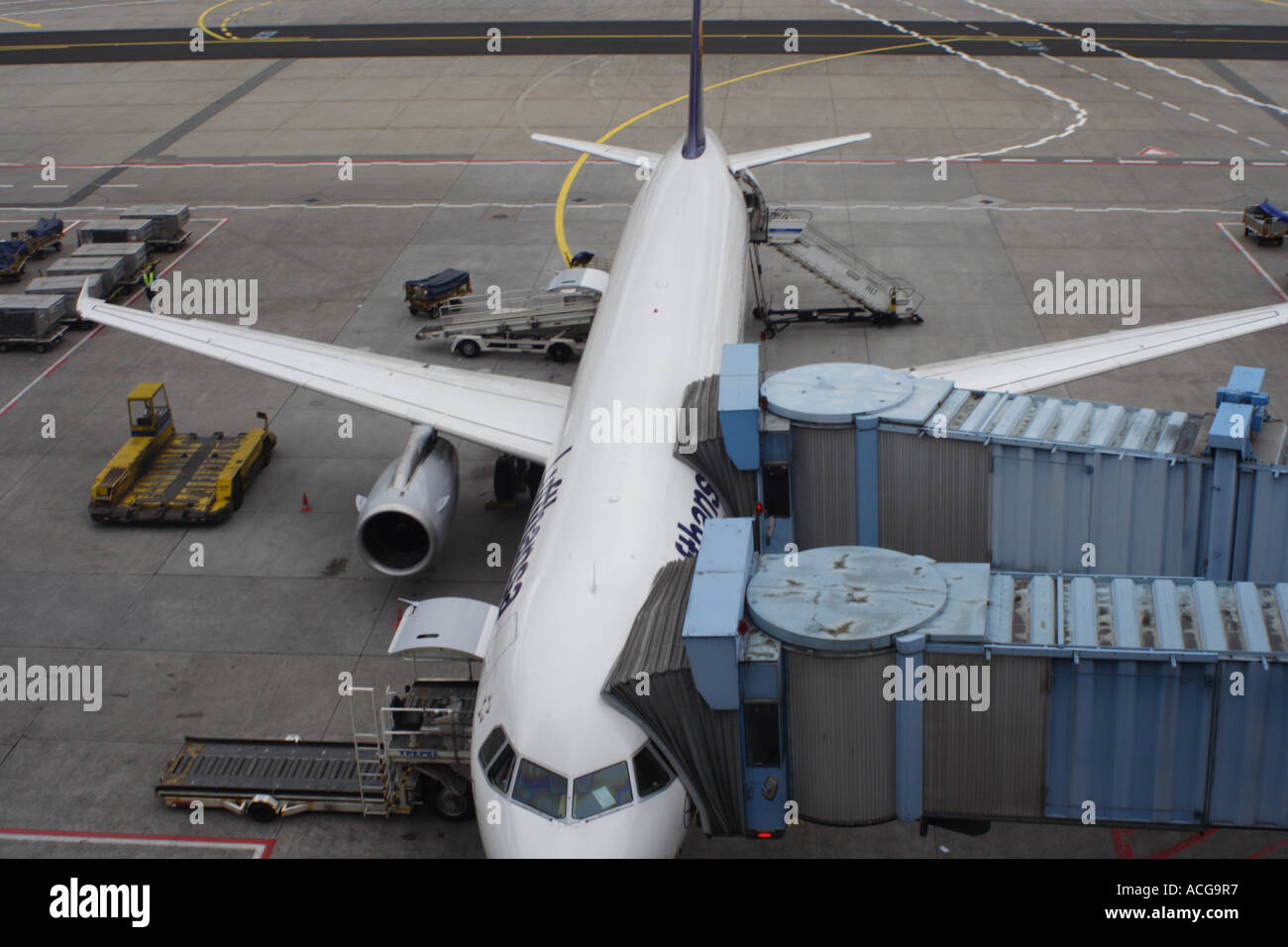 Loading the airplane Stock Photo - Alamy