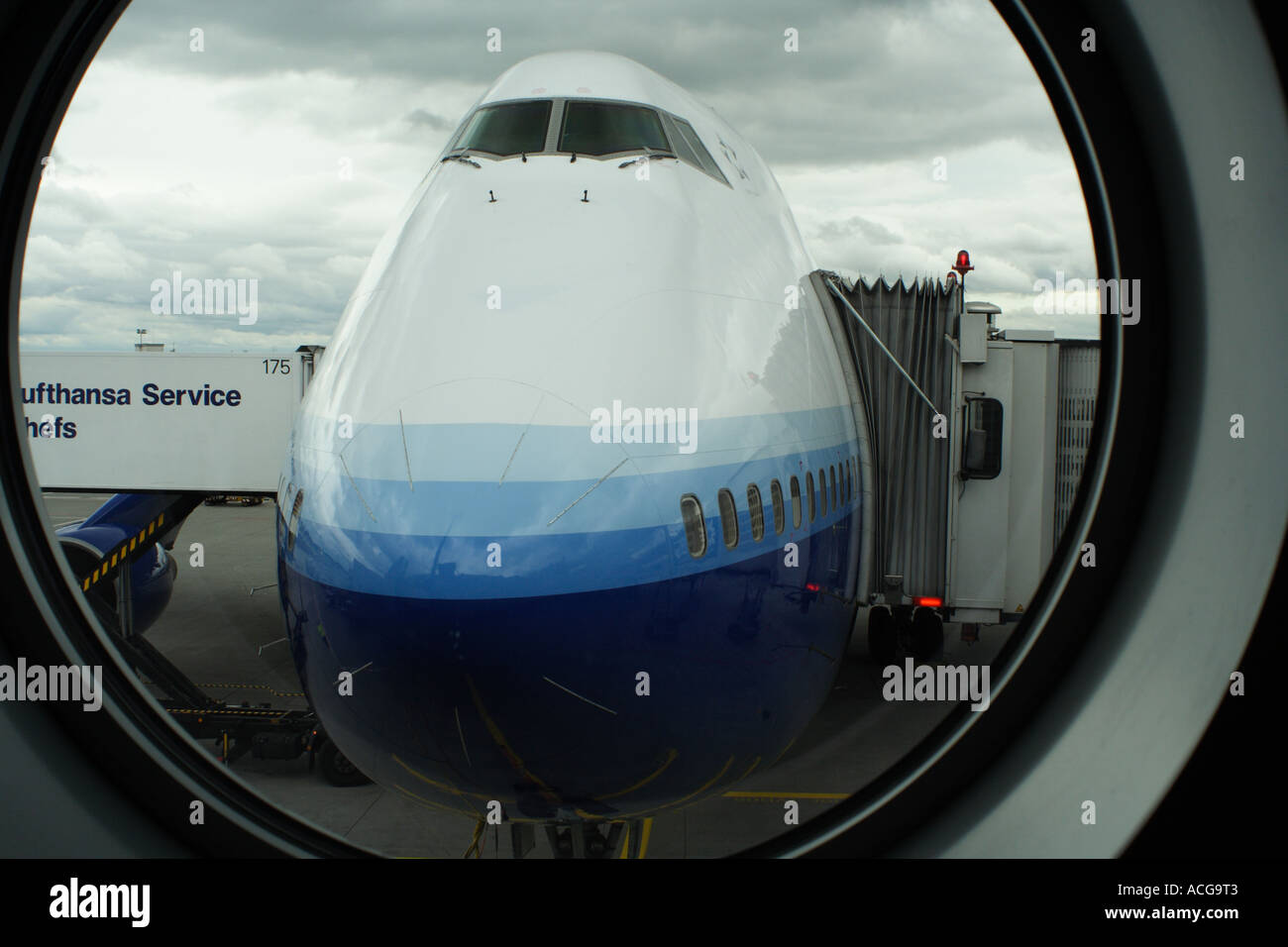 Airplane front view from round window Stock Photo - Alamy
