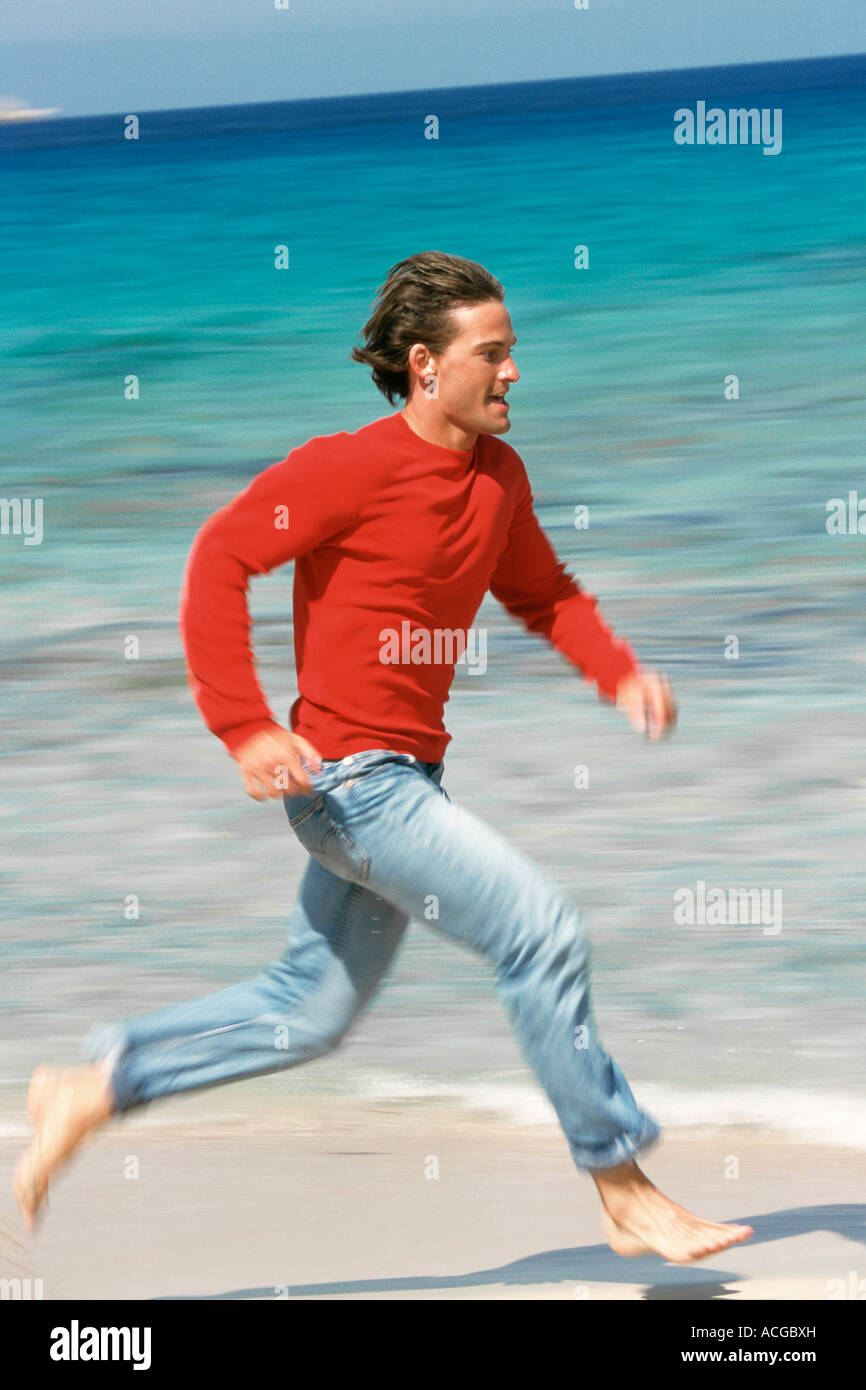 Man running in the seaside Stock Photo - Alamy