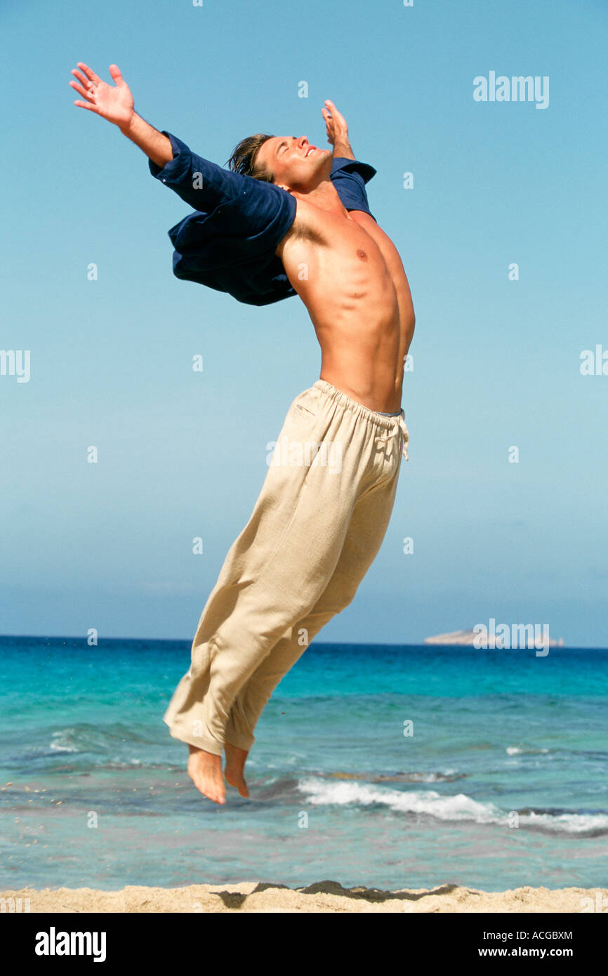 Man jumping sea Stock Photo - Alamy