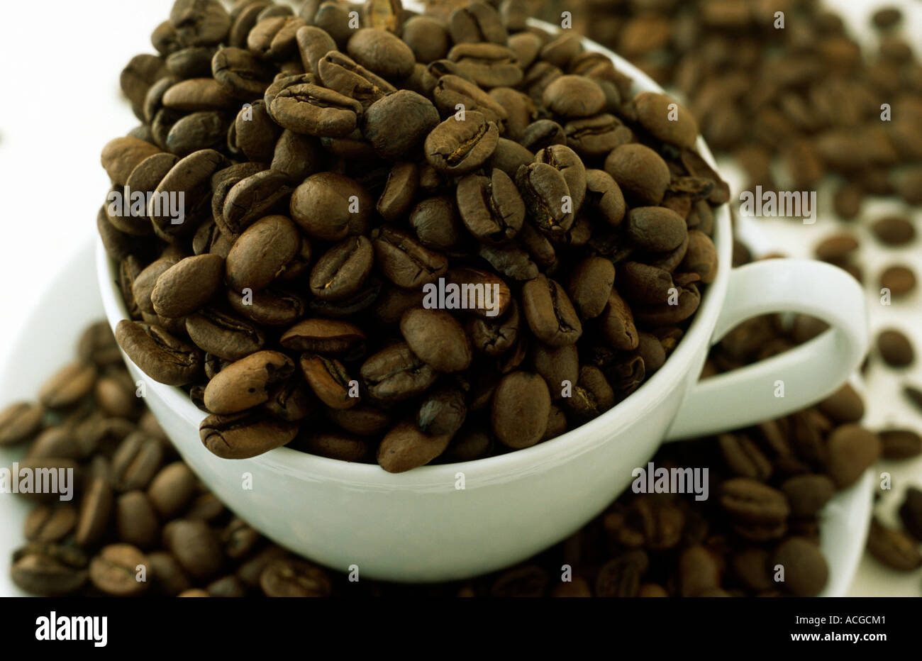 Coffee beans in cup Stock Photo - Alamy