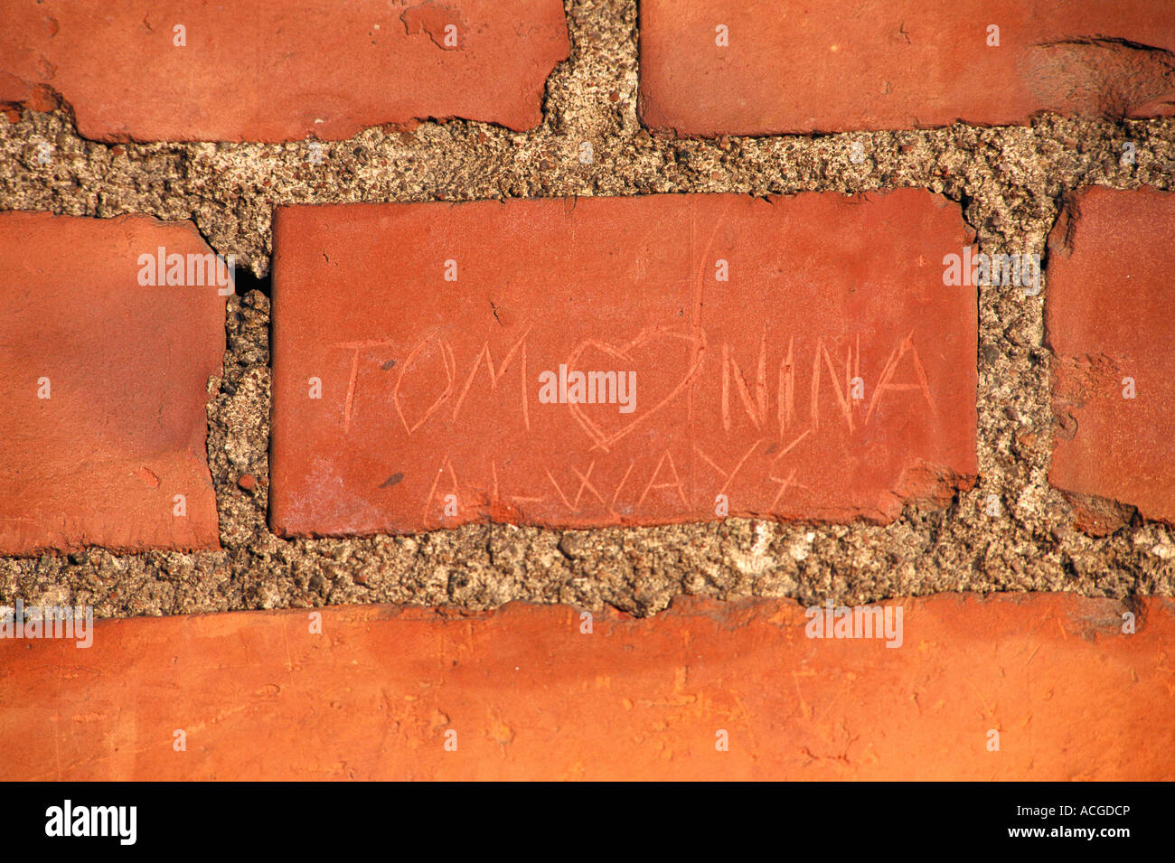 A love message on a brick wall Stock Photo - Alamy