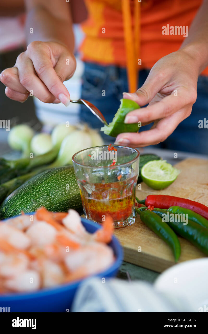 A person preparing a marinade in a glass Stock Photo - Alamy
