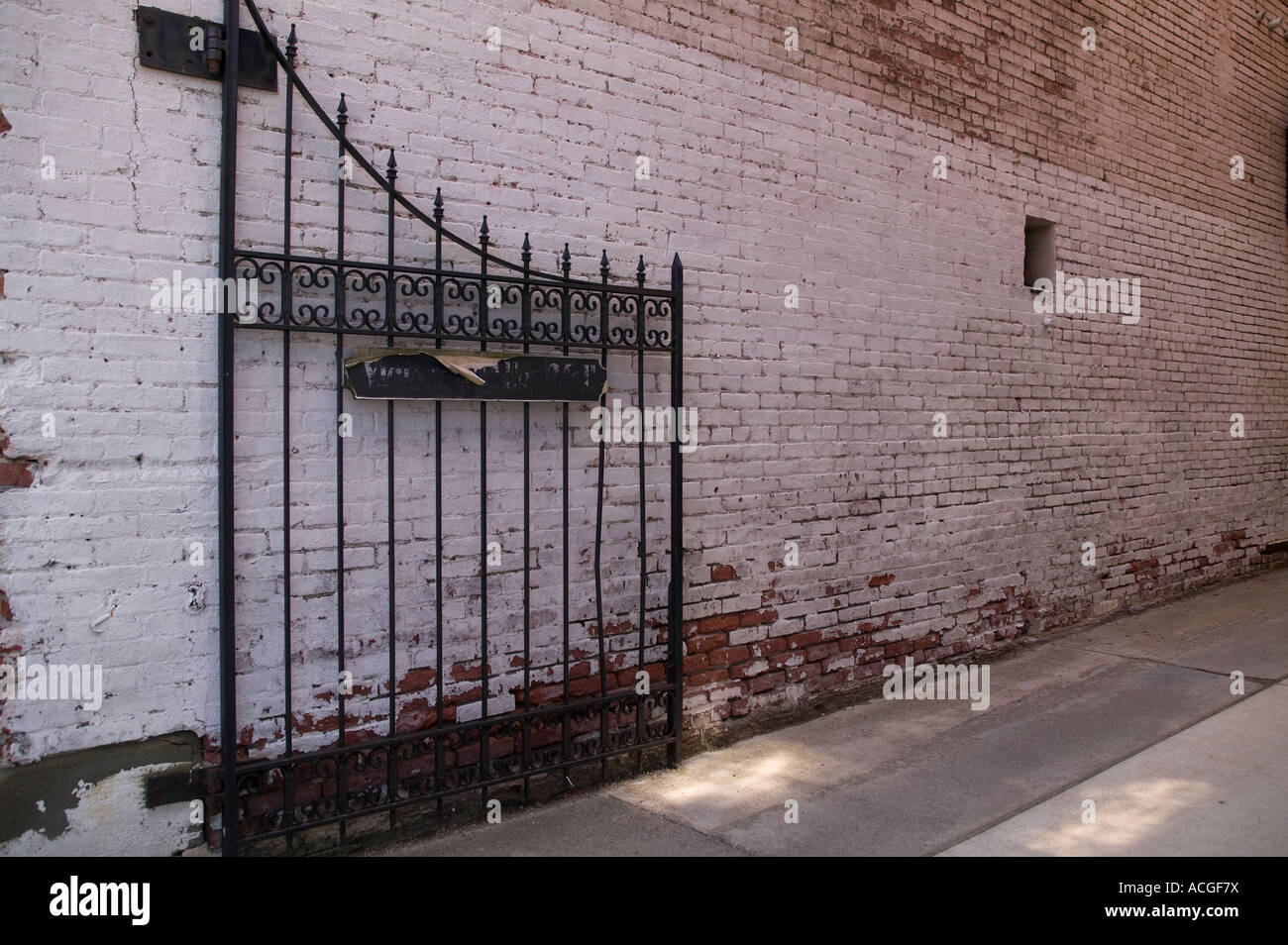 An iron gate in an alley in downtown Franklin Pennsylvania Stock Photo ...