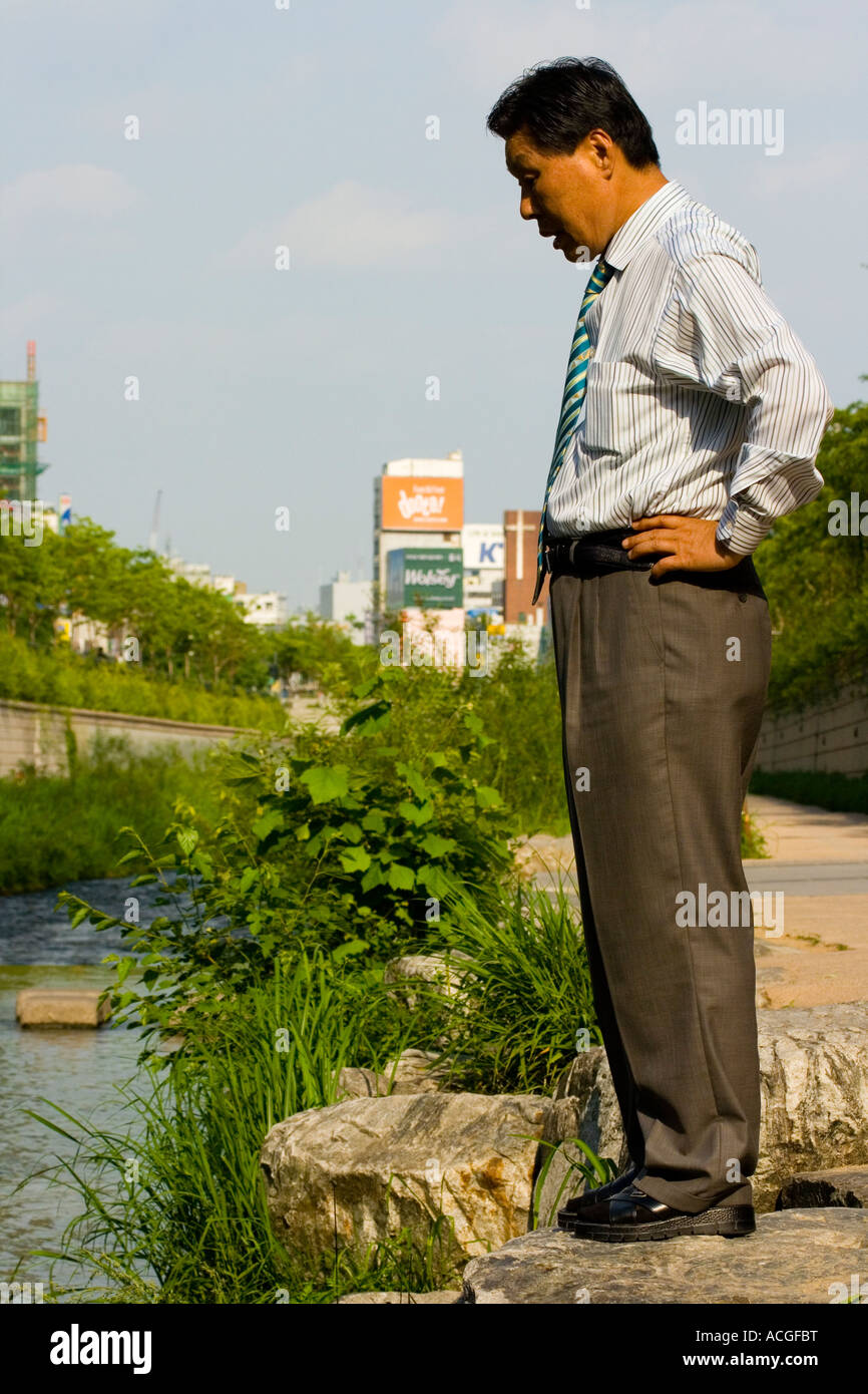 Korean Businessman next to Cheonggyecheon or Cheonggye Stream Seoul ...