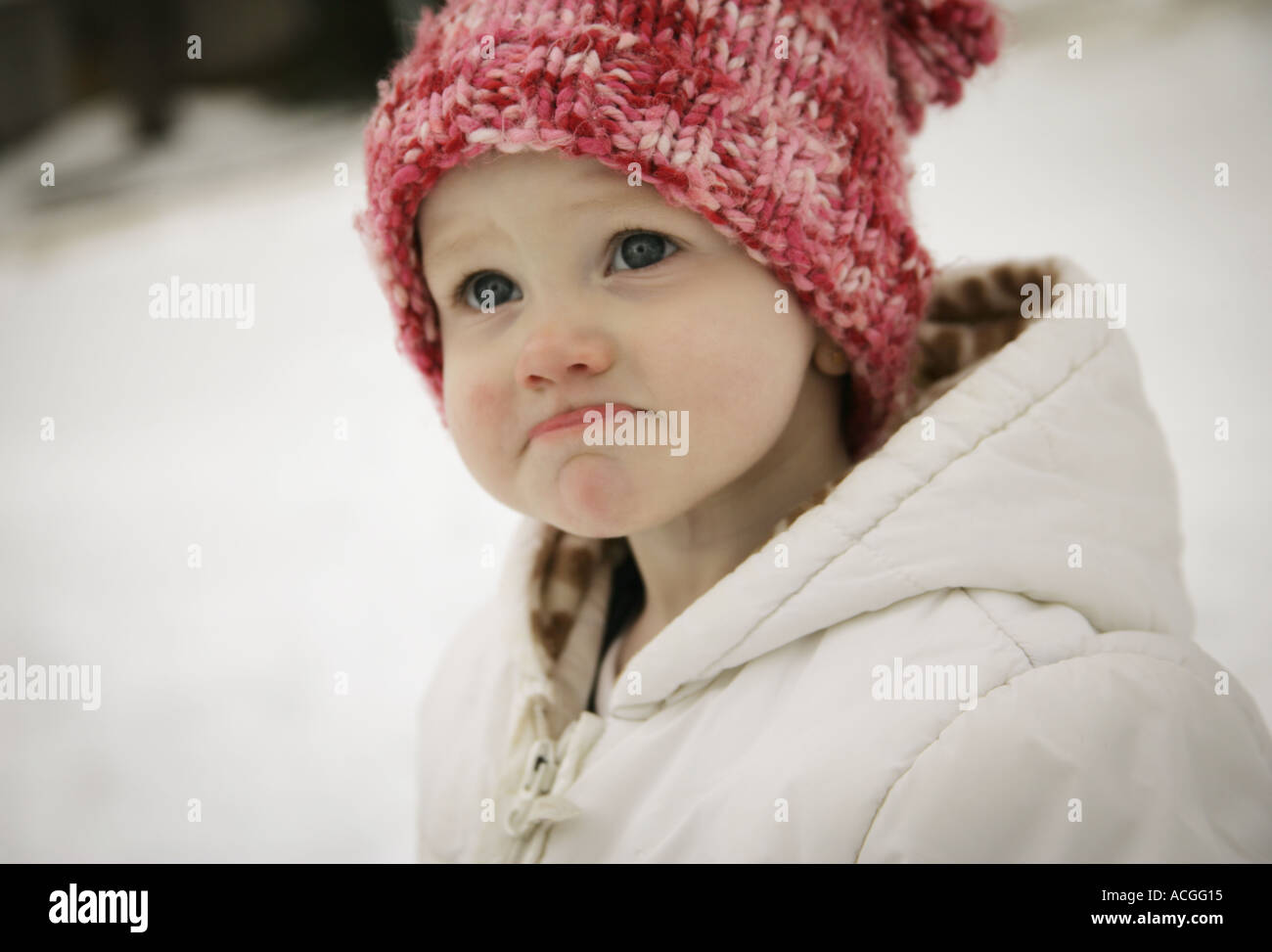 Little girl outside in the snow Stock Photo - Alamy