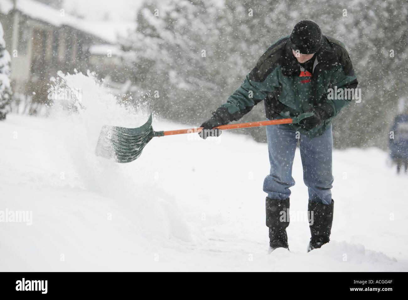 A man clearing snow Stock Photo - Alamy