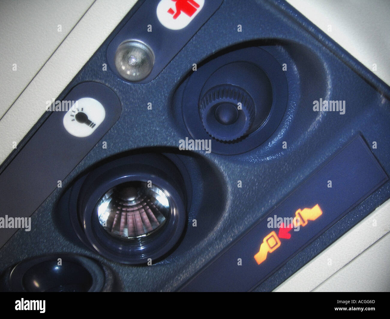 Passenger help on airplane Stock Photo - Alamy