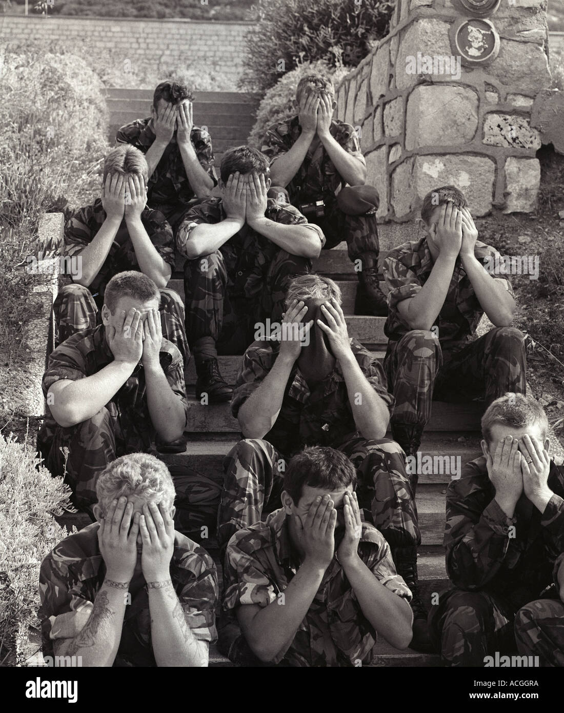 Soldiers cover faces to aviod being photographed Stock Photo - Alamy